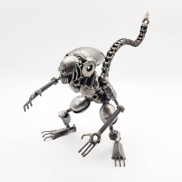 Crouching Alien Metal Figurine - Forests, Tides, and Treasures